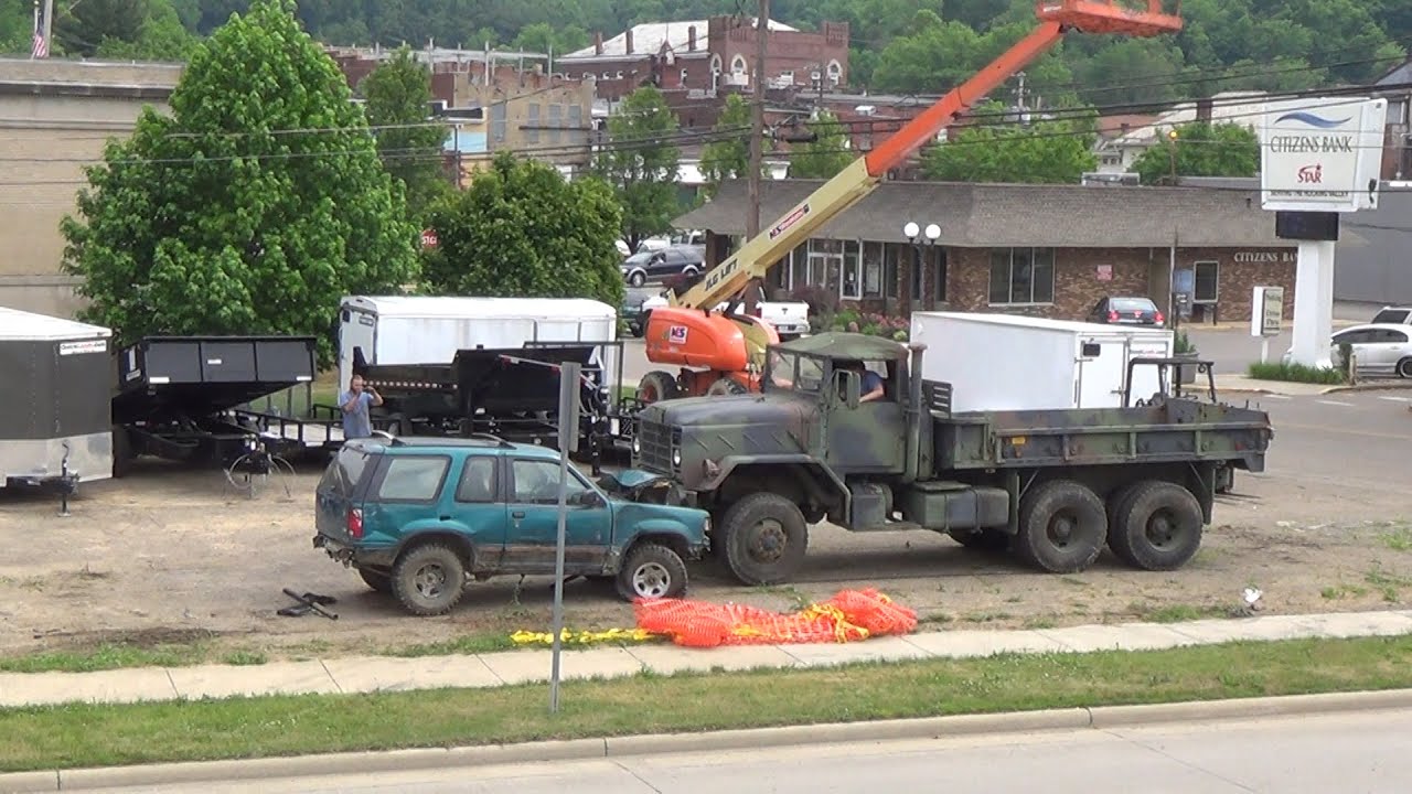 Crushing a Ford Explorer with a Military Truck - YouTube