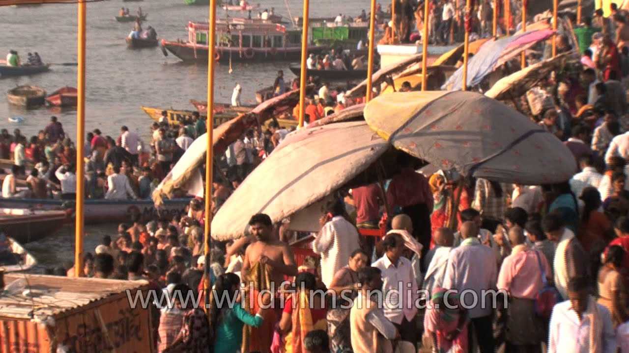 Bathing in the holy waters of river Ganga at Varanasi during Maha ...