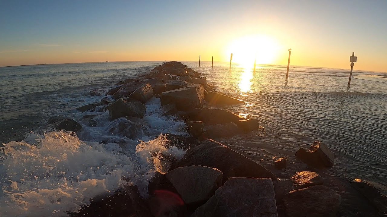 Fishing the low tide at NSB jetty rocks. - YouTube