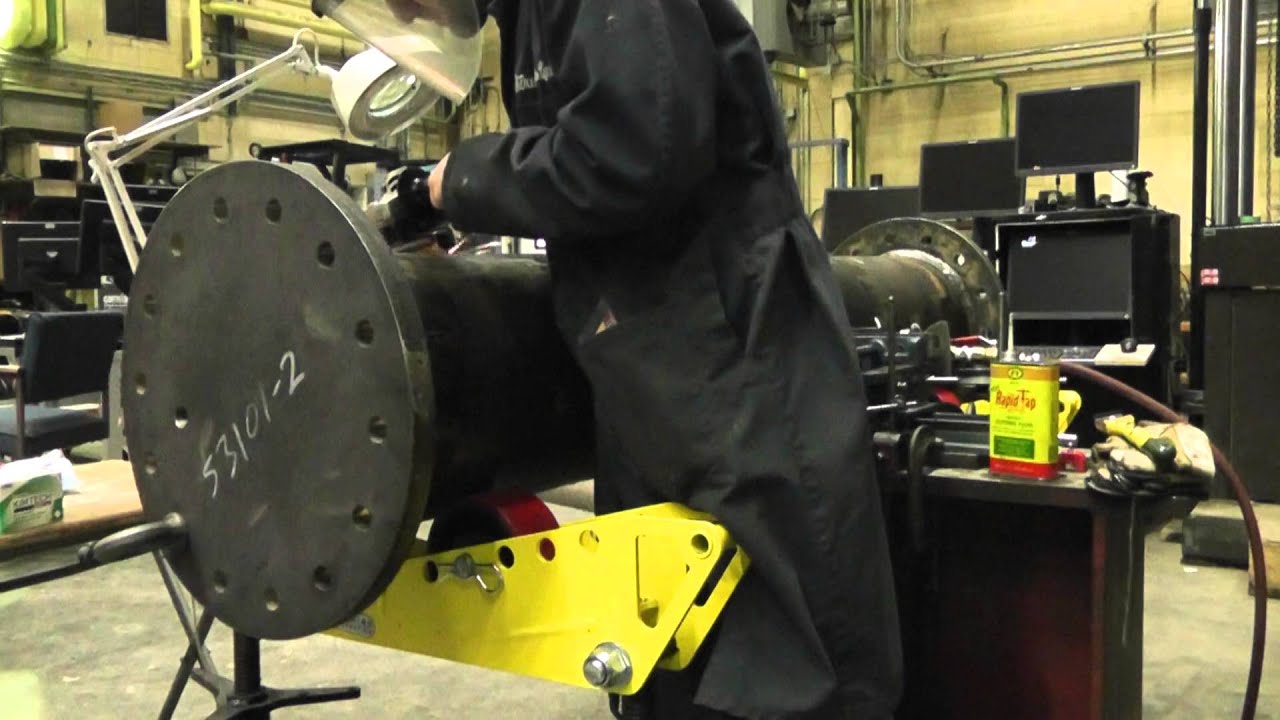 Smoothing the pipe surface with an angle grinder and abrasive wheel ...