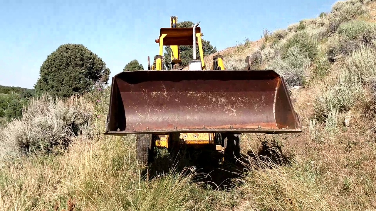 79 Ford 445 Backhoe Backwards Through Big Ruts! - YouTube