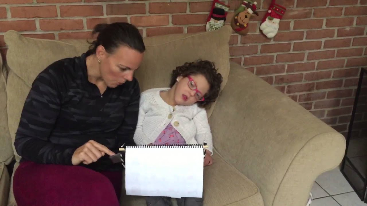 Angela using PODD with partner assisted scanning. - YouTube