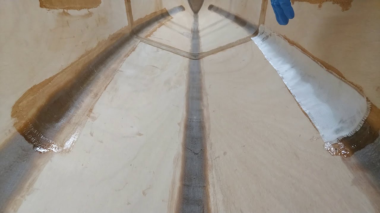 Fiberglassing a stitch and glue plywood canoe, until it becomes ...