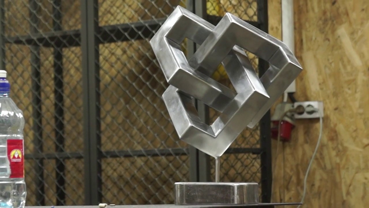 knot metal rotation sculpture - YouTube