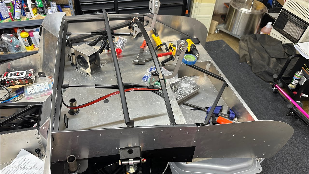 Day 152: Trunk assembly, gas struts, radio, wheels, insulation, more ...