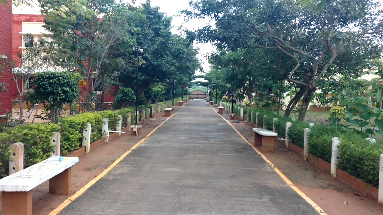 Walk way aside facility and accommodation blocks at Nandhavanam Old Age ...