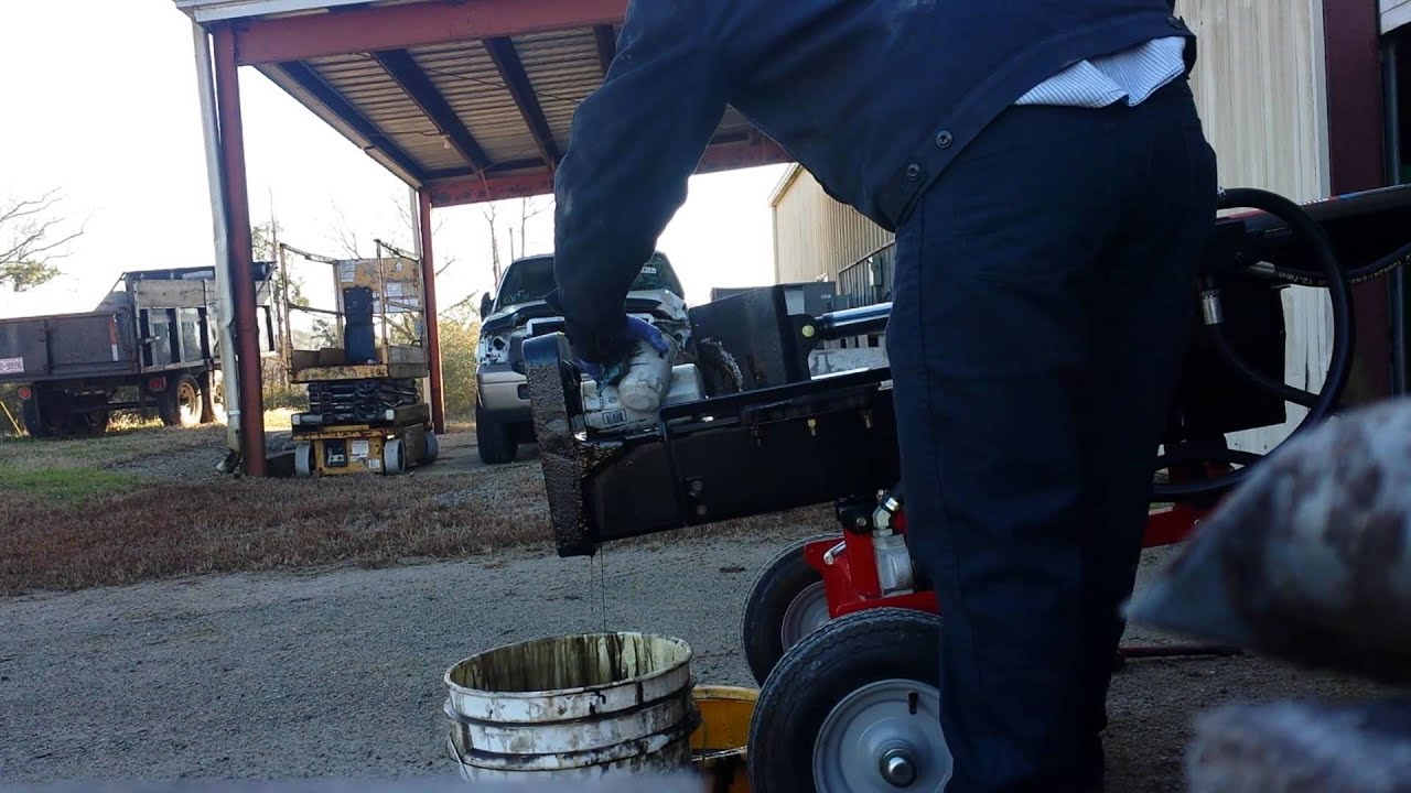 Crushing truck oil filters with log splitter - YouTube