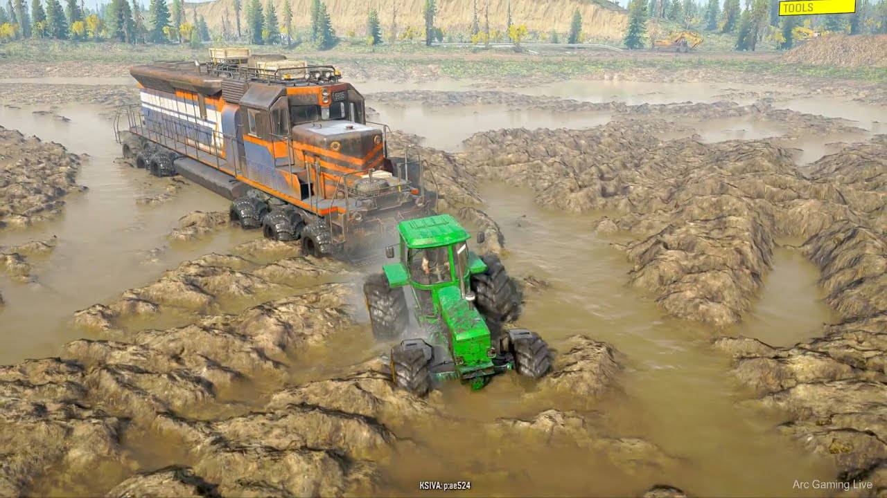 TRAIN LOCOMOTIVE STUCK IN MUD - TRACTOR RESCUING TRAIN FROM MUD ...