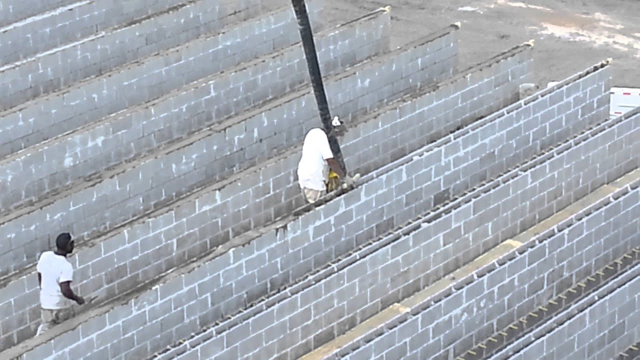 Pumping grout mix into 17' tall block walls - YouTube