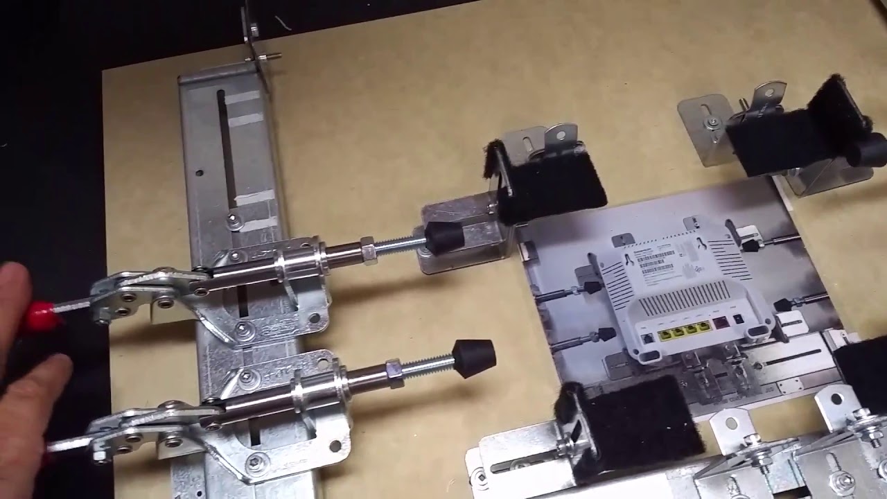 Fixture to split open clam shell style plastic housings. - YouTube