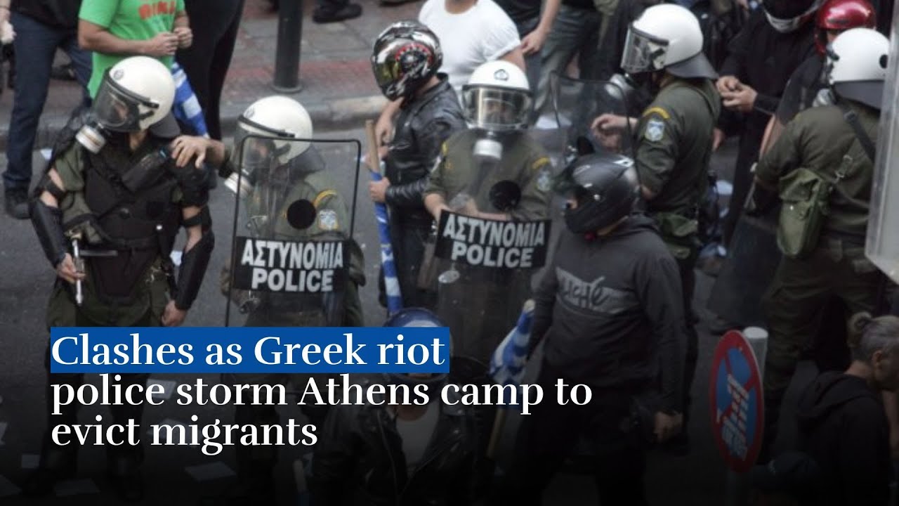 Clashes as Greek riot police storm Athens camp to evict migrants - YouTube