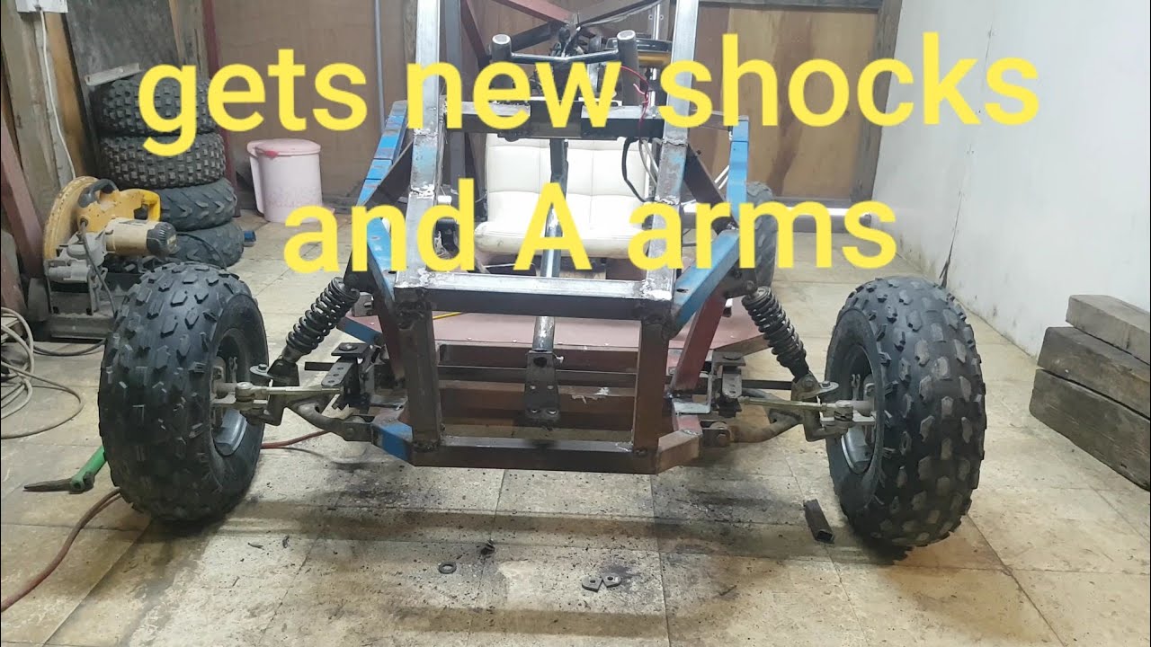 Homemade Buggy gets new shocks, A arms and bigger tire - YouTube