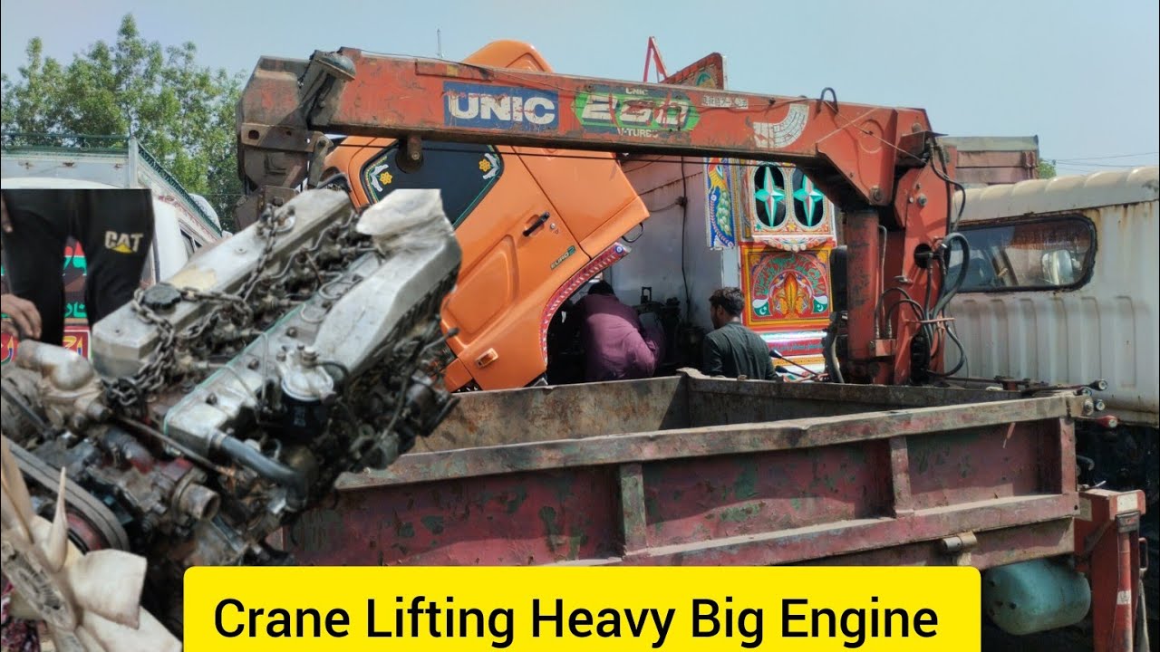 Crane Lifting Heavy Big Diesel Engine by Chain Pulley & Fitting into ...