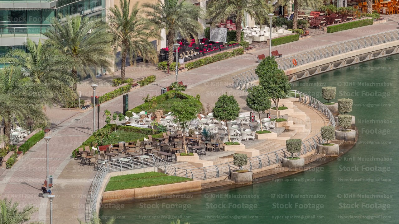 Waterfront promenade in Dubai Marina aerial timelapse. Dubai, United ...