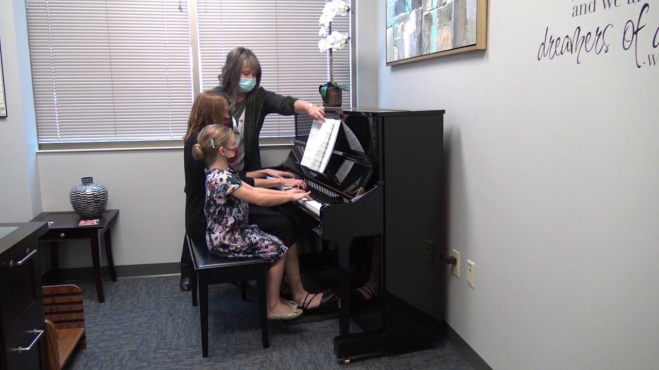 Colette Althoff with mom, Jennifer Althoff. Colette is a piano student ...