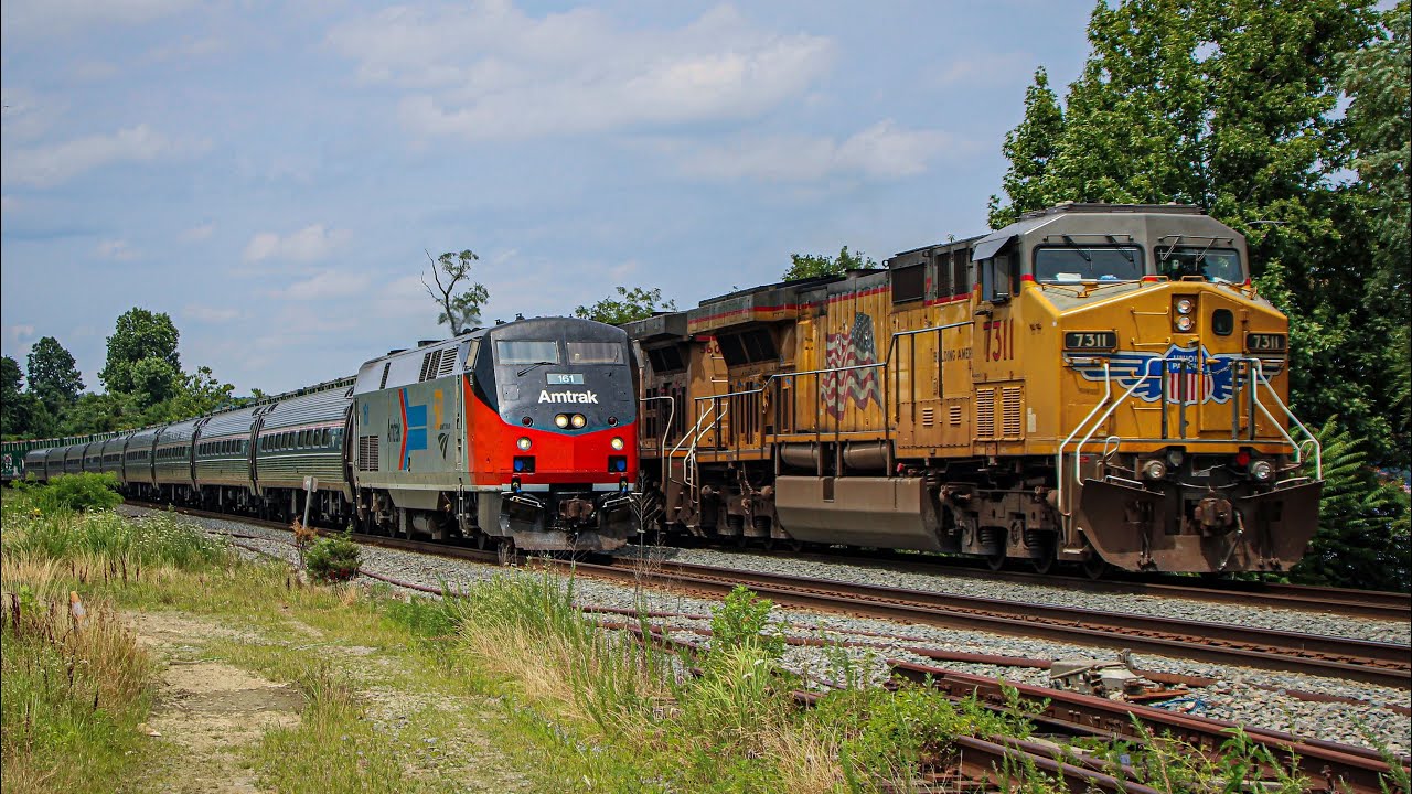Amtrak 50th Anniversary Phase I HU #161 Leads P153 Past a Stopped M409 ...