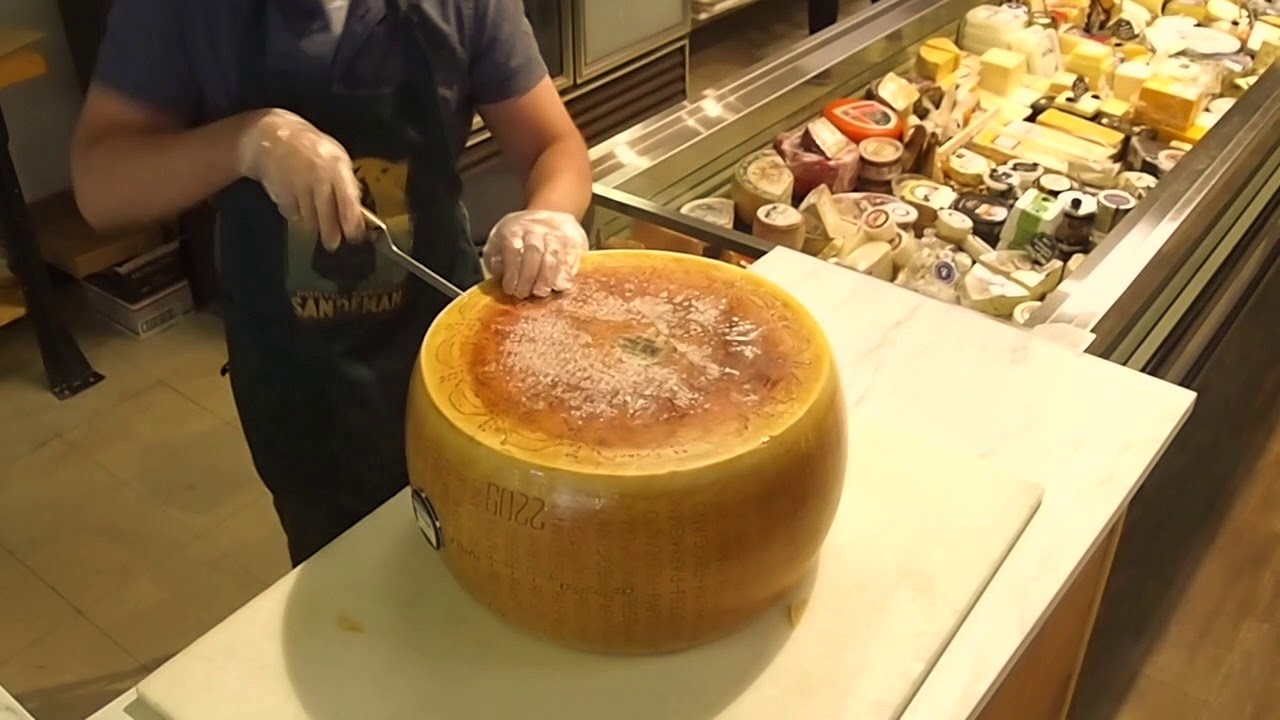 How to open an 80lb Wheel of Parmesan - YouTube