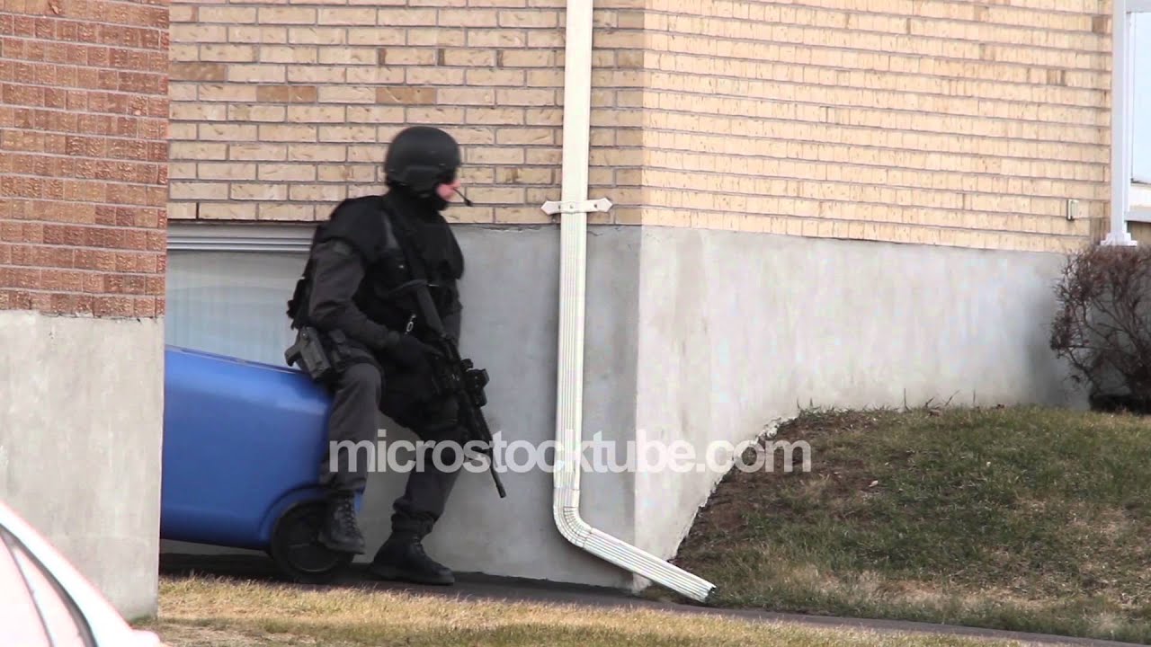 SWAT officer with M16 sitting on garbage bin - YouTube