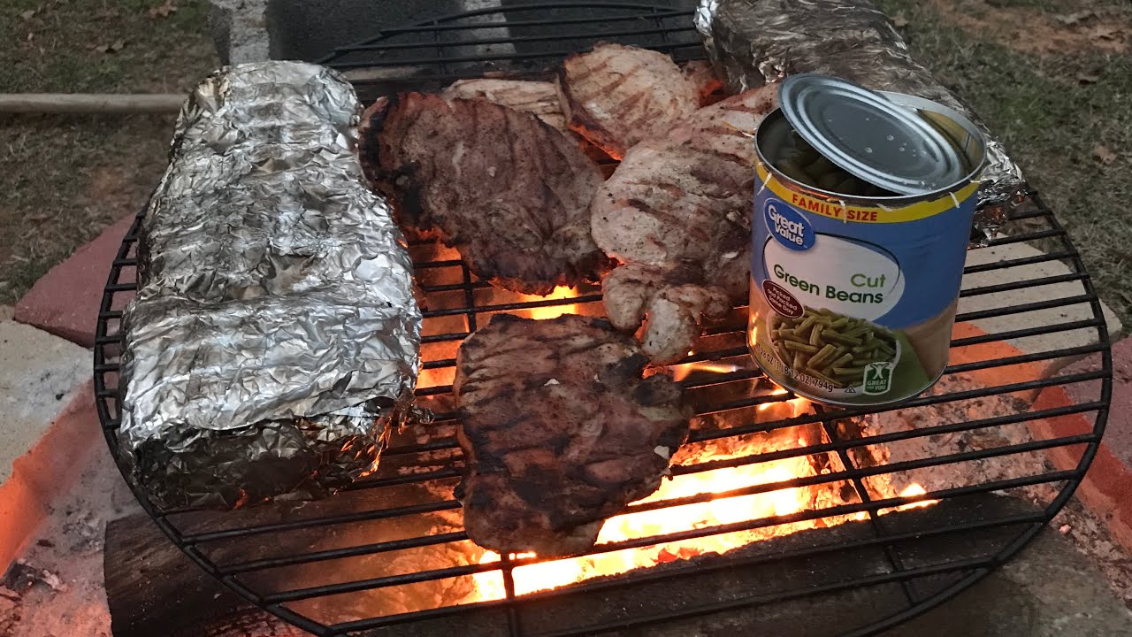 CAMPFIRE COOKING- potatoes in foil and pork chops - YouTube