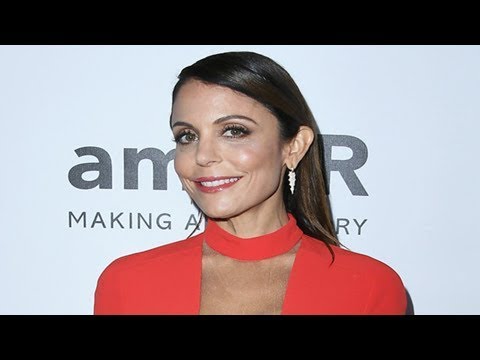 Real housewives' bethenny frankel, 46, goes braless in frontless dress