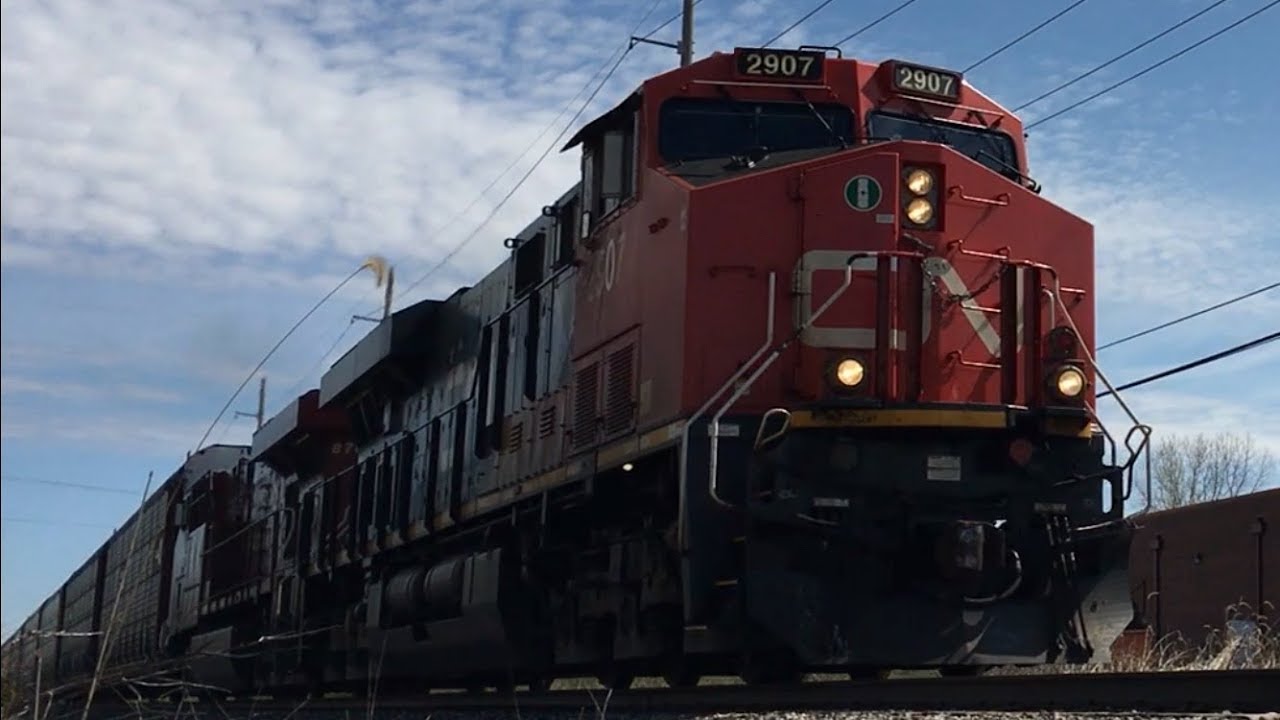 CN 2907 Leads CP 8703 Southbound With Empty Autos - YouTube