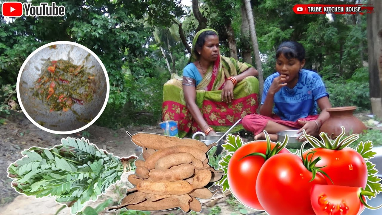 Tribal woman and daughter cooked tentulia leaf and tamato curry in desi ...