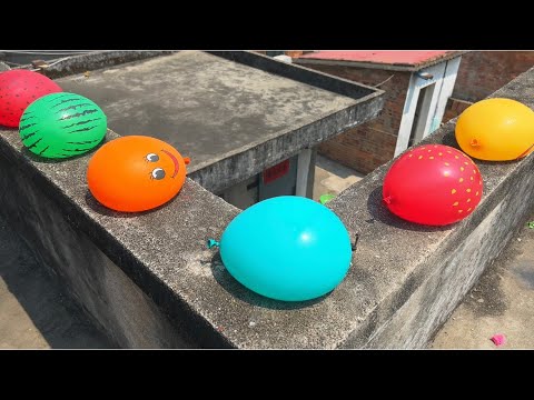 Experiment: Will a water balloon explode if it rolls down from a tall ...