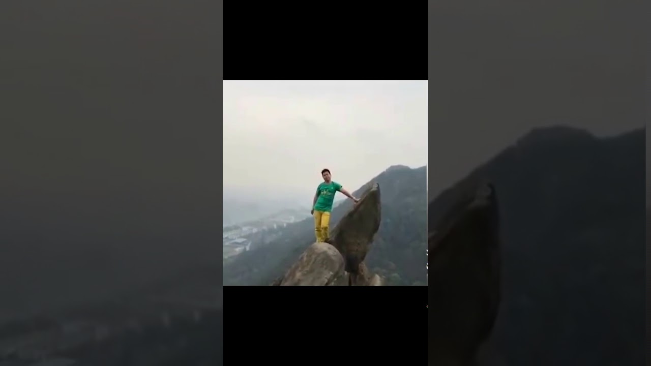 Man Falls off cliff accidentally after showing off! - YouTube