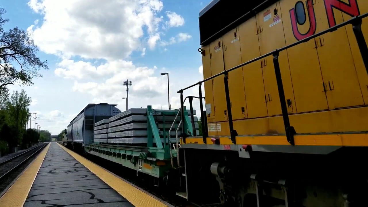 UP YNO68 with ex-SP GP40 and CNW caboose in Park Ridge - YouTube