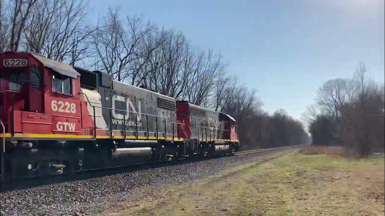 CN/IC GP40R 3102 leads GTW GP38-2 6228 and a single boxcar on the Woodstock Local - YouTube
