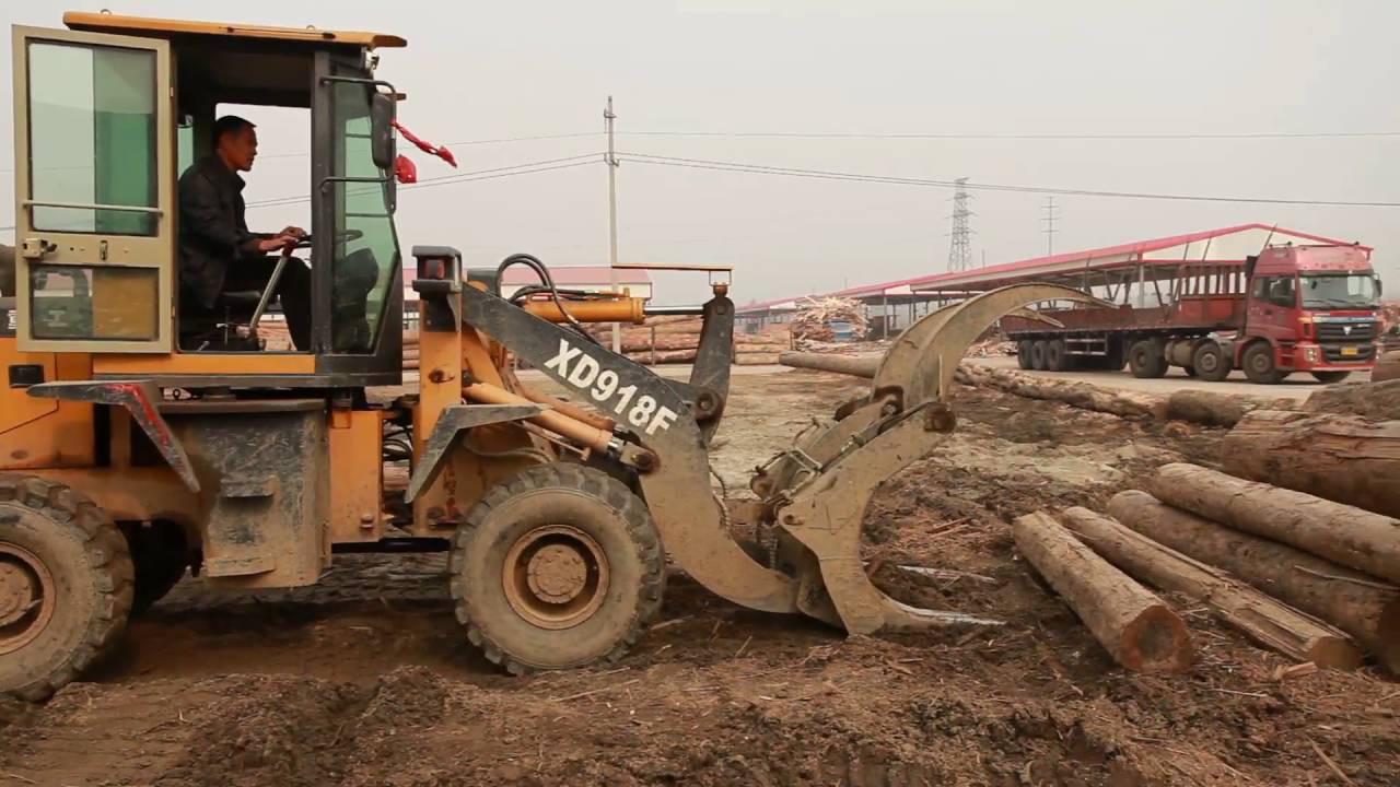 XD918 log grabber loader at customer's wood processing plants - YouTube