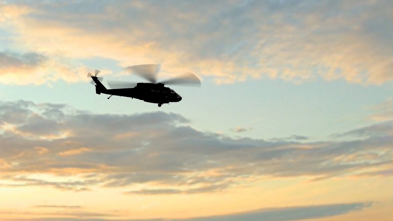 BLACK HAWK Helicopter fly over in the sunset - royalty Free Video ...