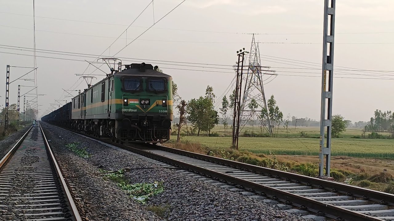 Freight train with double green locomotive engine wag-9hc carrying 45 ...