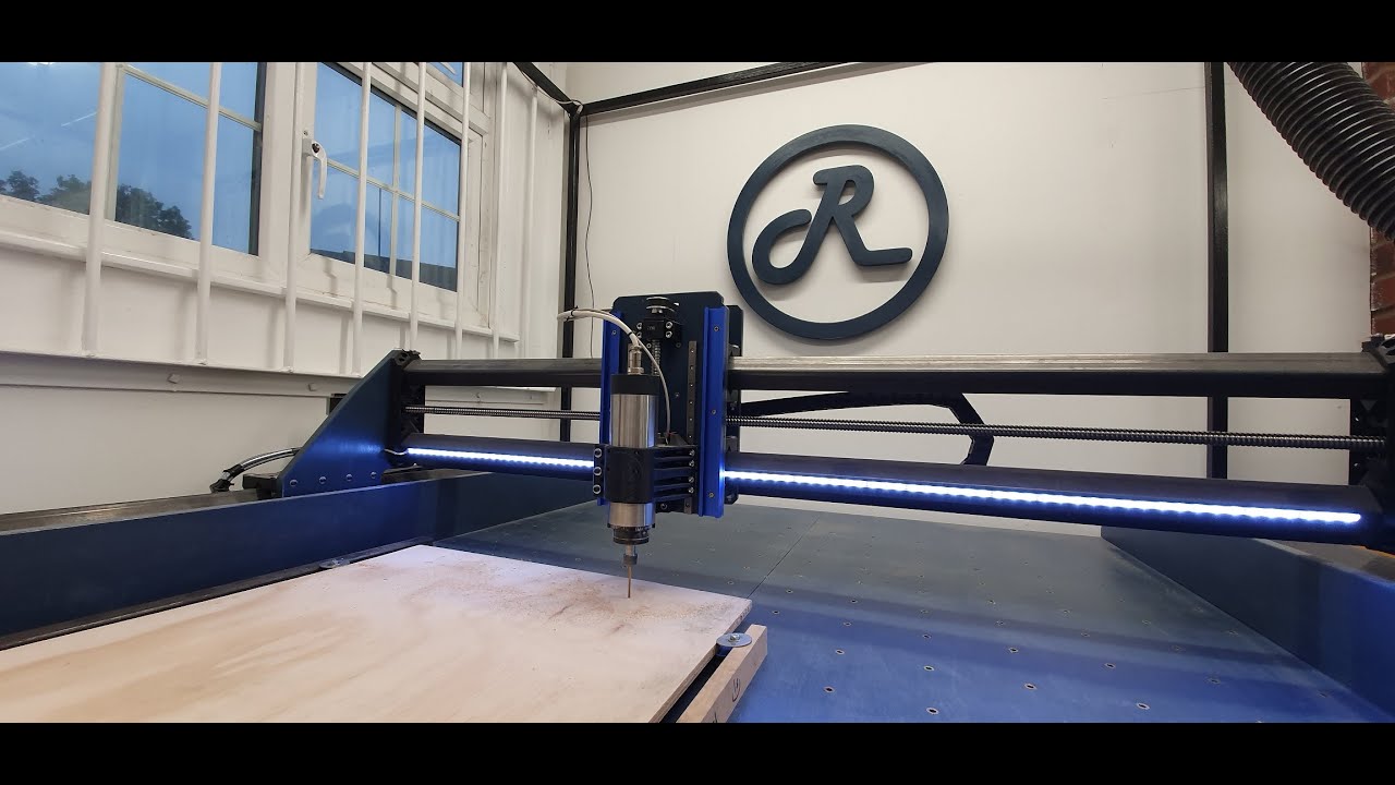 Root 4 3D Printed CNC machine cutting its own logo in plywood - YouTube