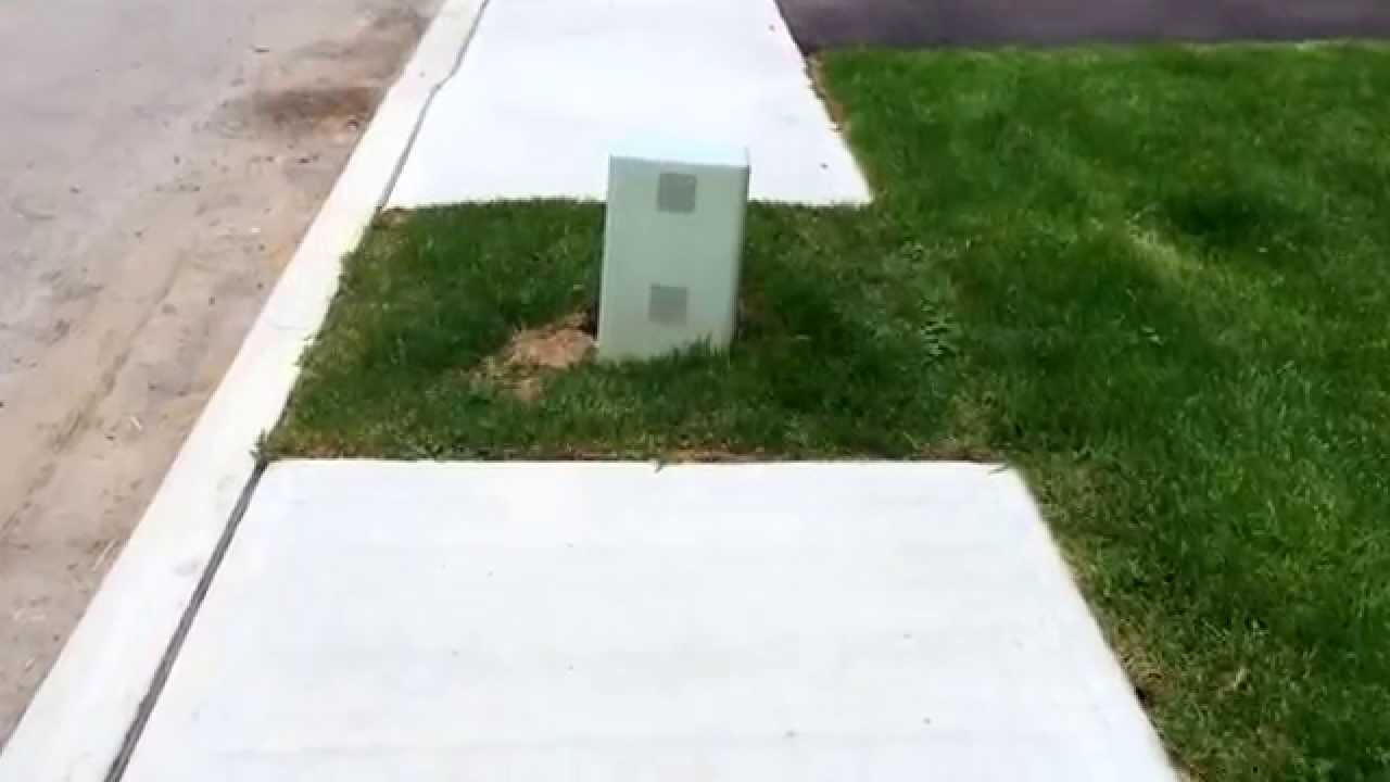Crazy sidewalk with utility boxes and grass - YouTube