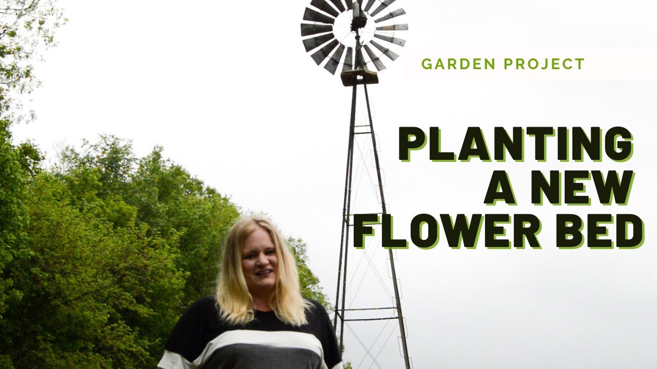 Planting the New Triangle Flower Bed - YouTube