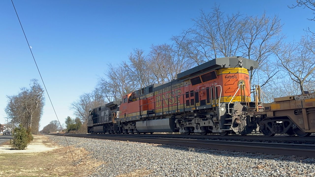 NS 9962 leads NS 268 through Manville NJ with a BNSF AC44CW trailing ...