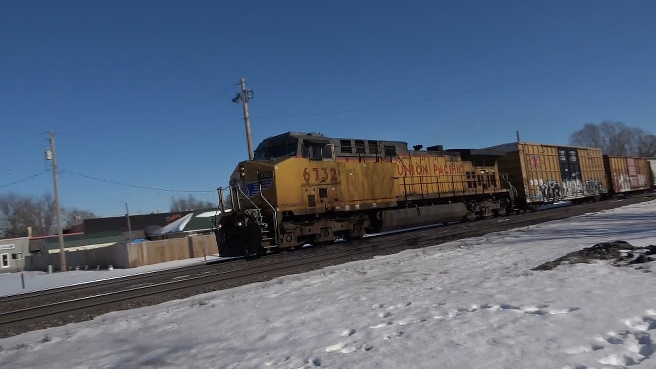 Ex CNW AC4400 leads a UP mixed freight, 2X3X1 coal train with CNW cars, CNW hoppers on a mx ...