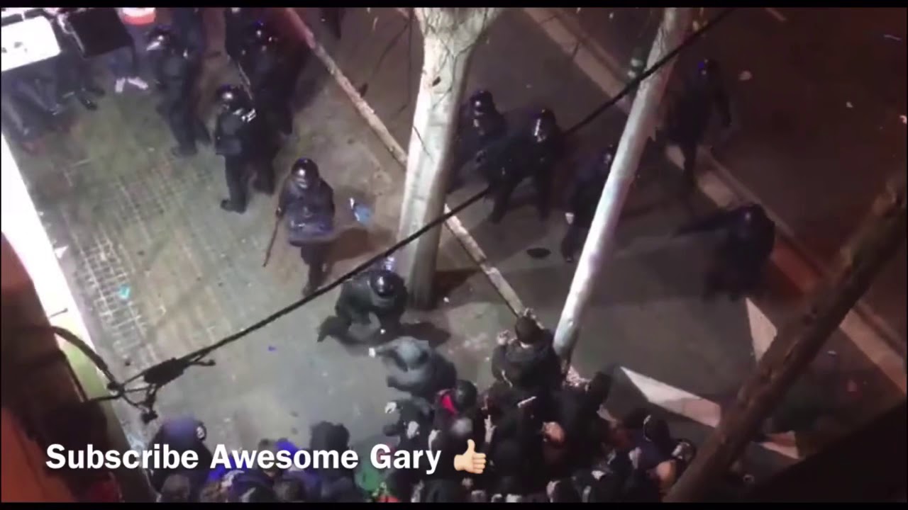 M Riot police attacks pro-independence protesters outside the Camp Nou ...