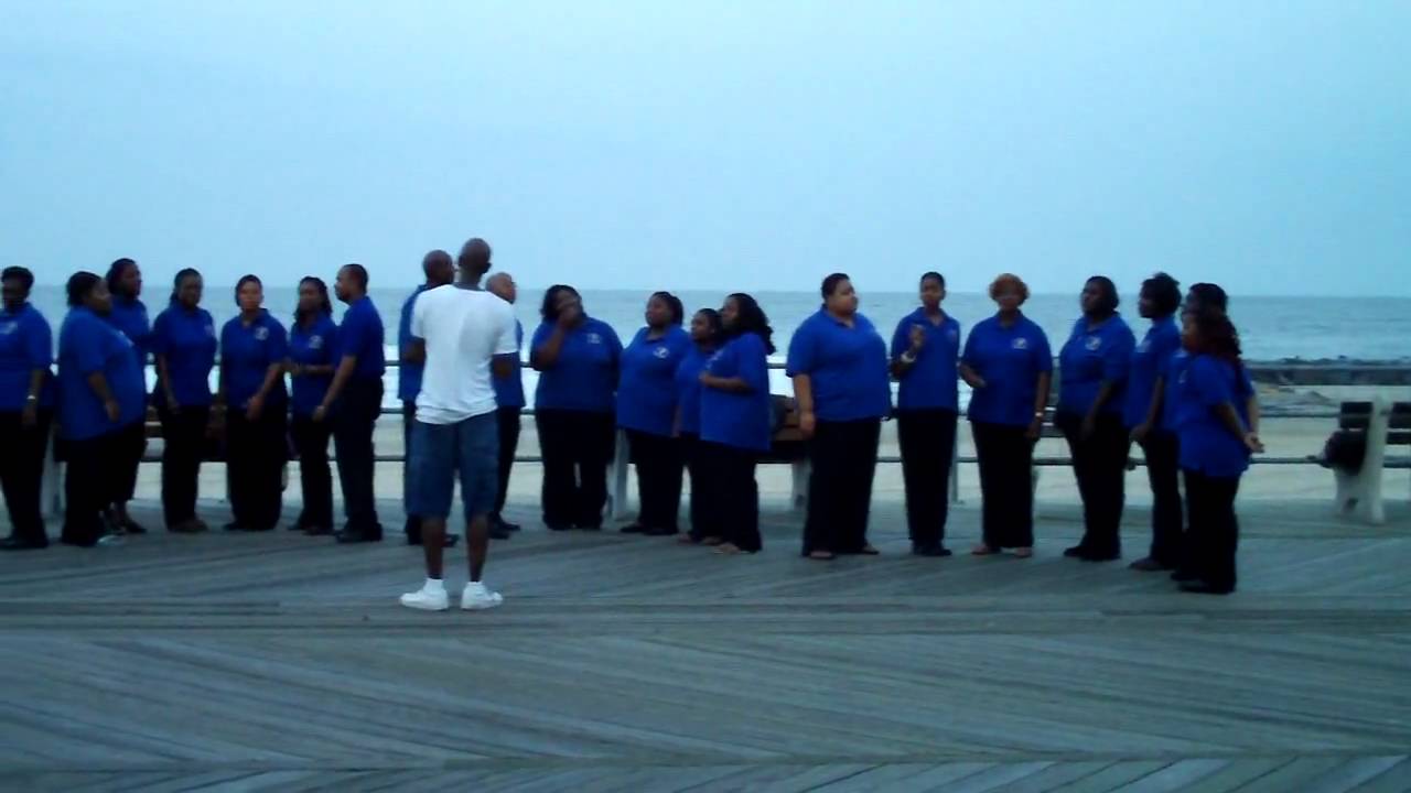 The Chorale singing at the Beach in front of the Ocean Praise Him in ...