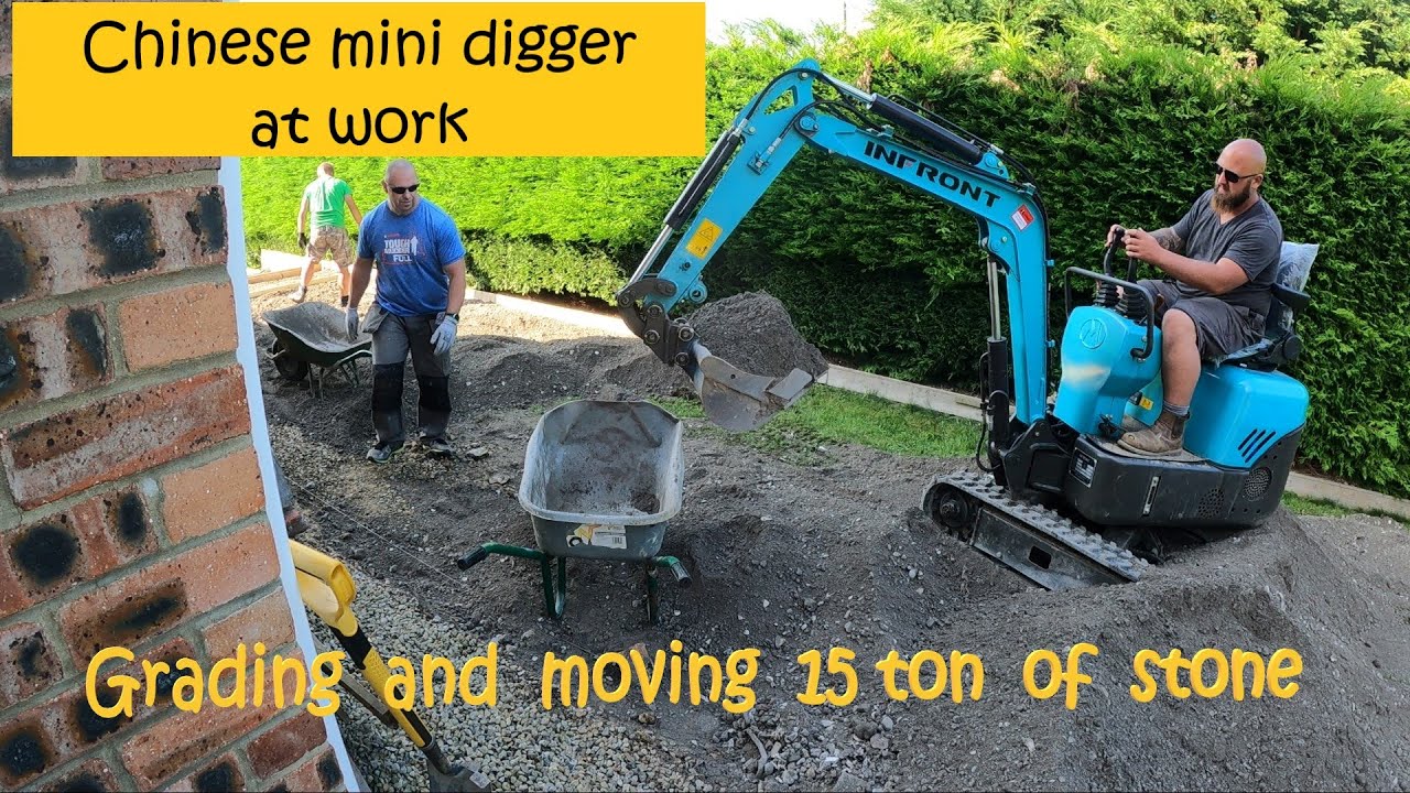The Chinese mini digger at work again... grading and loading stone [and ...