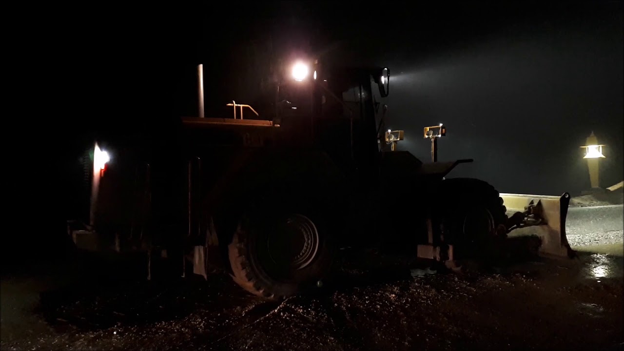 CAT Caterpillar 824H wheel dozer drives by at midnight - YouTube