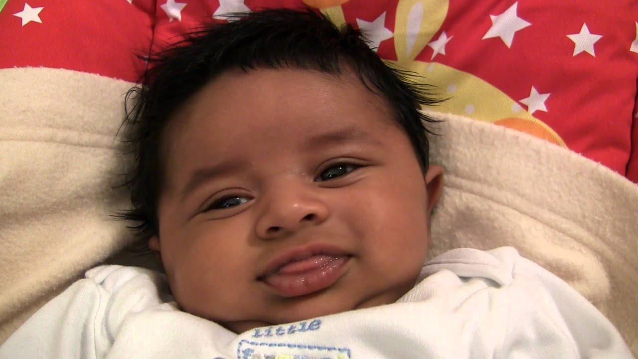 Baby waking up and making funny faces - YouTube