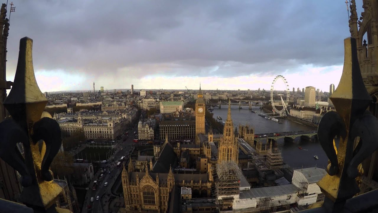 Rain storm passing over London with rainbow, viewed from the Victoria ...