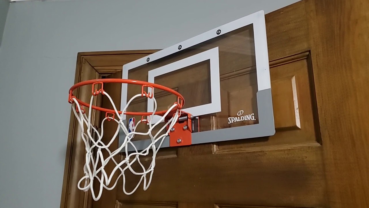 Spalding Mini Basketball Hoop hanging on the back of a door. - YouTube