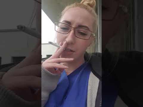 Blonde nurse smoking after a long day