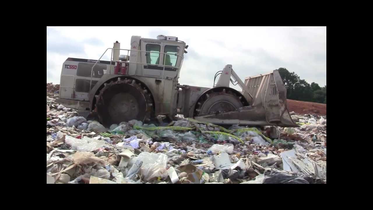 Terex TC550 Landfill Compactor Powers Through Mounds of Trash - YouTube