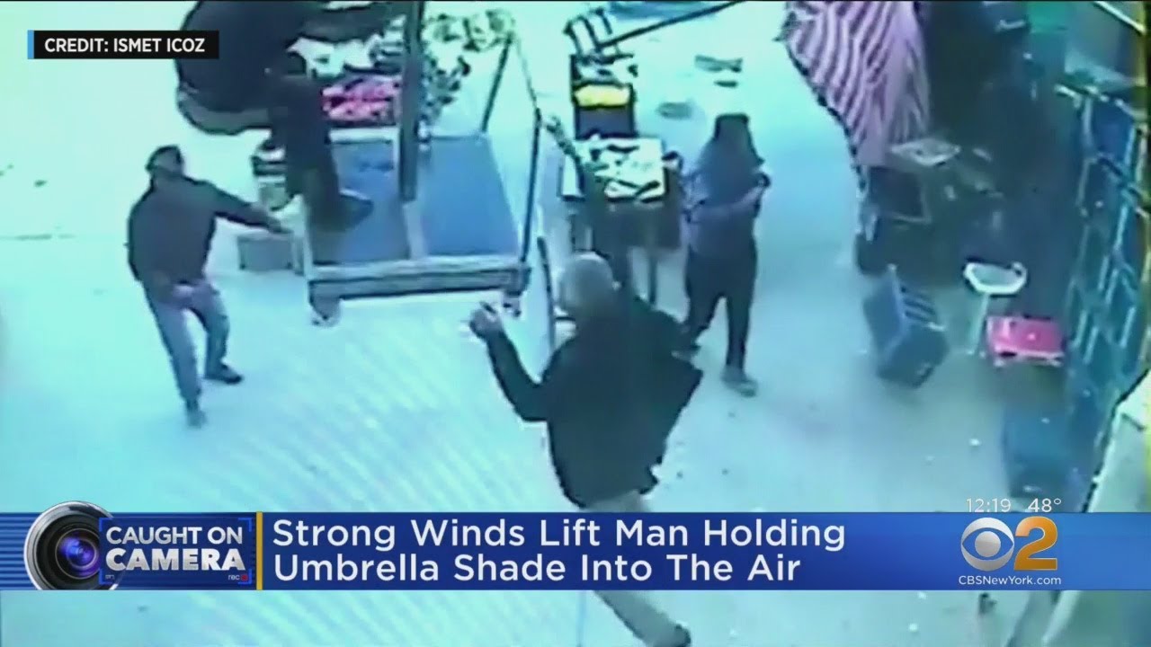 Strong Winds Lift Man Holding Umbrella Shade Into The Air - YouTube