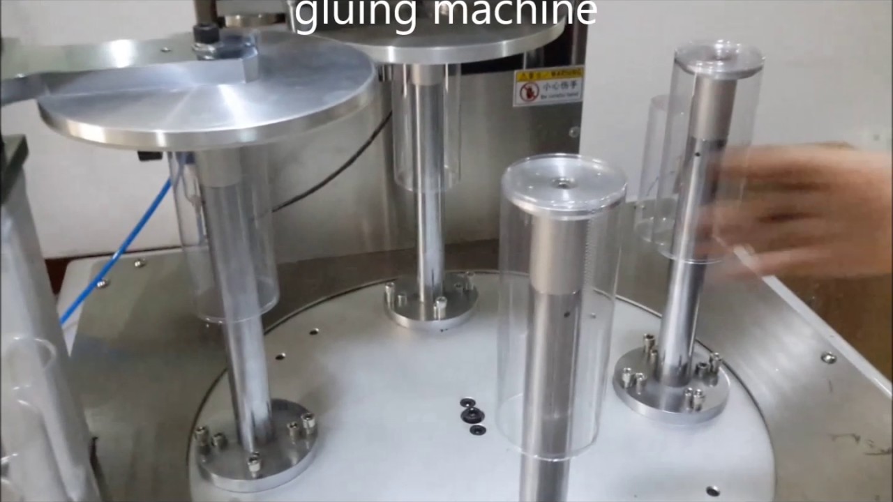 Rotary cylinder tube bottom gluing machine - YouTube