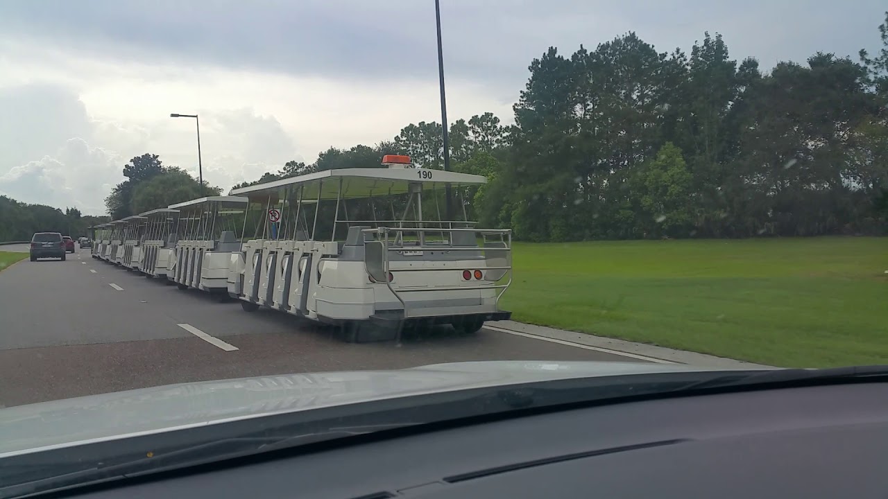 New Disney tram being driven on the highway into animal kingdom - YouTube